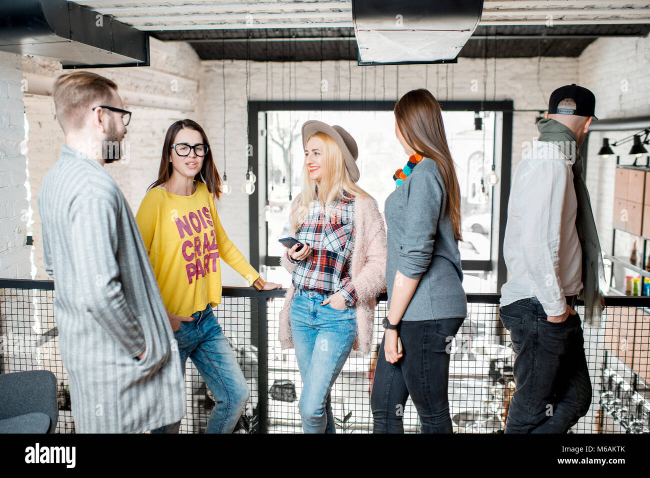 Friends talking during the break in the conference hall Stock Photo - Alamy