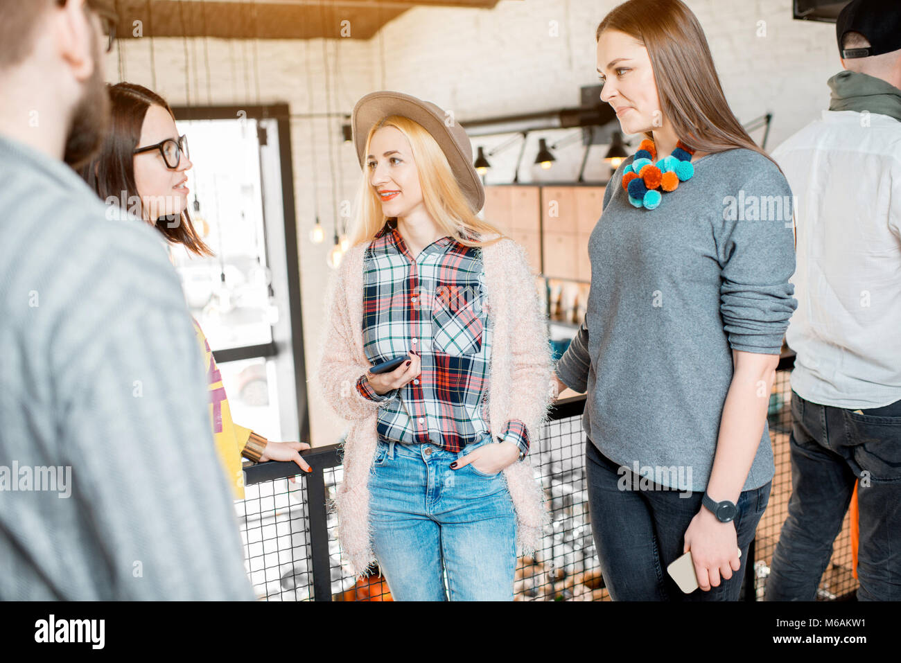 Friends talking during the break in the conference hall Stock Photo - Alamy
