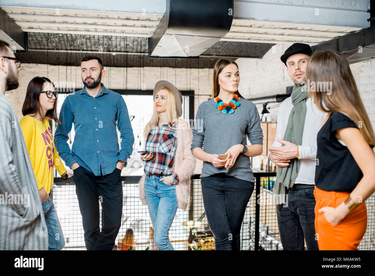 Friends talking during the break in the conference hall Stock Photo - Alamy