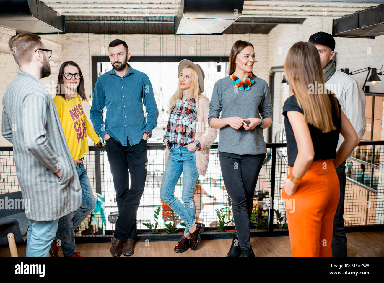 Friends talking during the break in the conference hall Stock Photo - Alamy