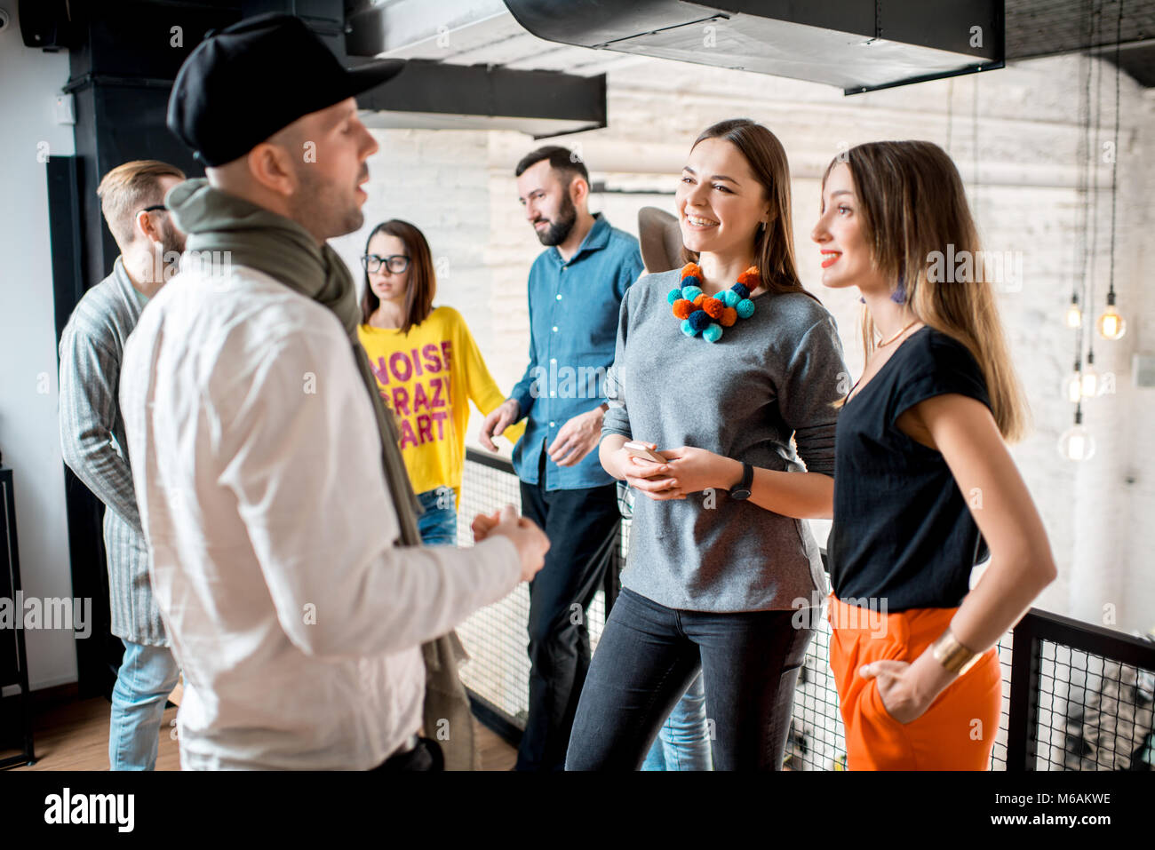 Friends talking during the break in the conference hall Stock Photo - Alamy