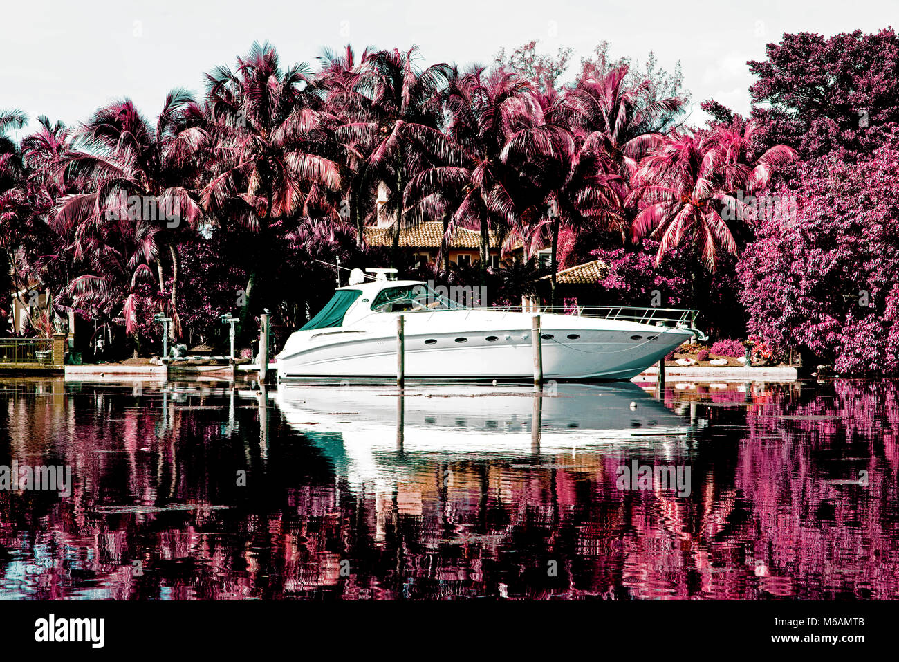 Infrared photography of a river and a motorboat and landscape in Miami ...