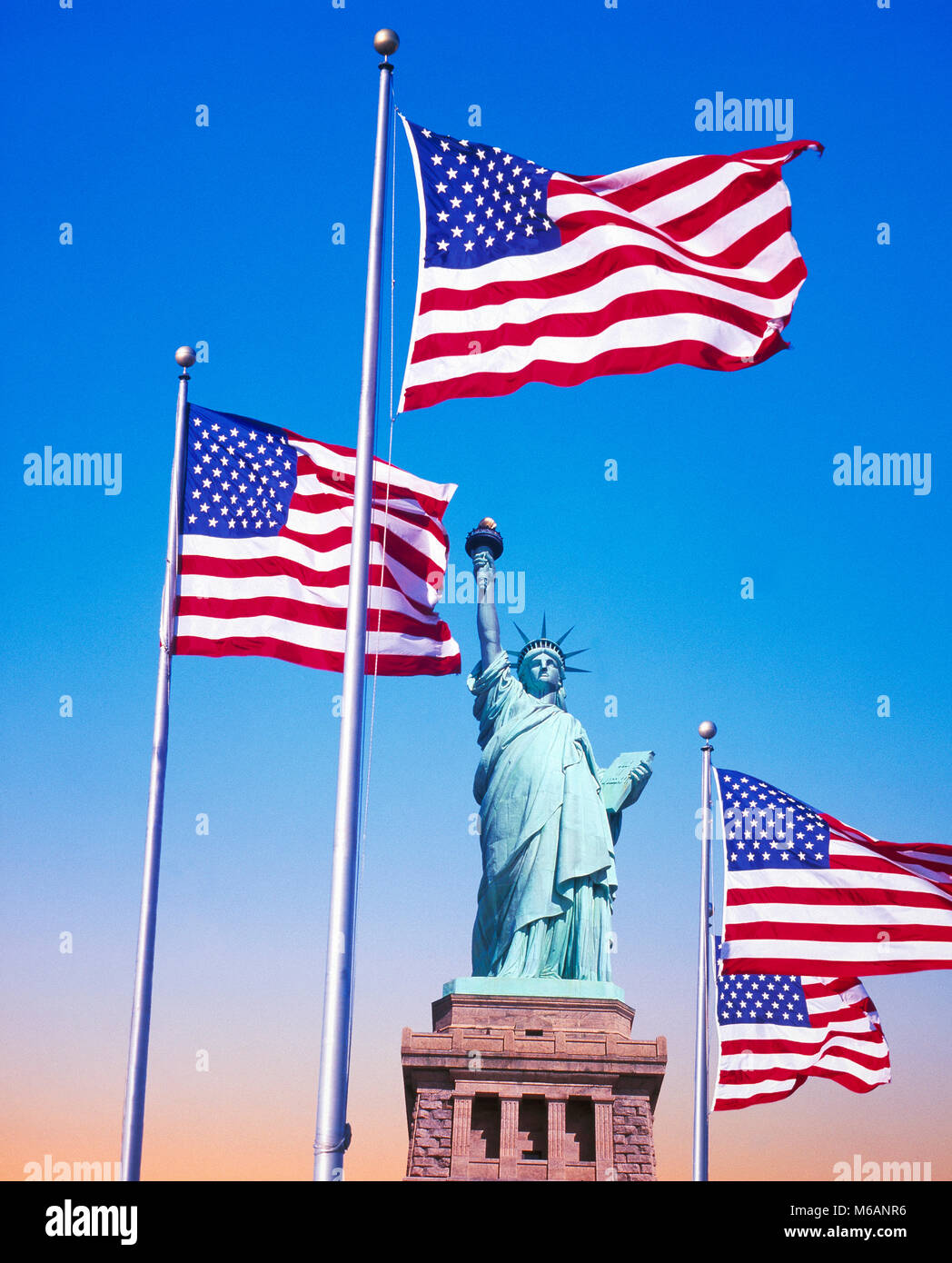 Statue of Liberty, and the Stars and Stripes flags,Liberty Island New ...