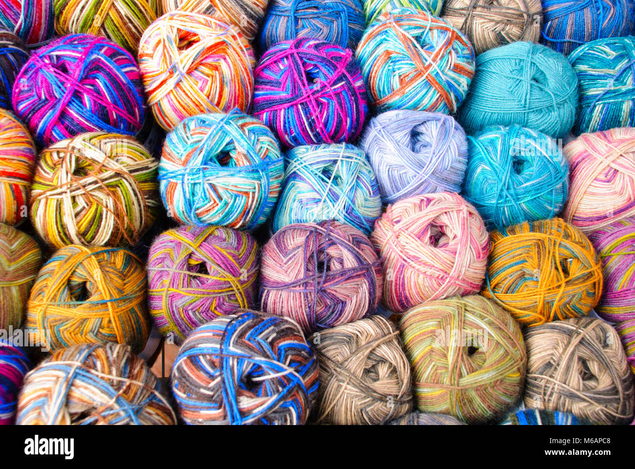 Colorful wool balls next to eachother Stock Photo - Alamy