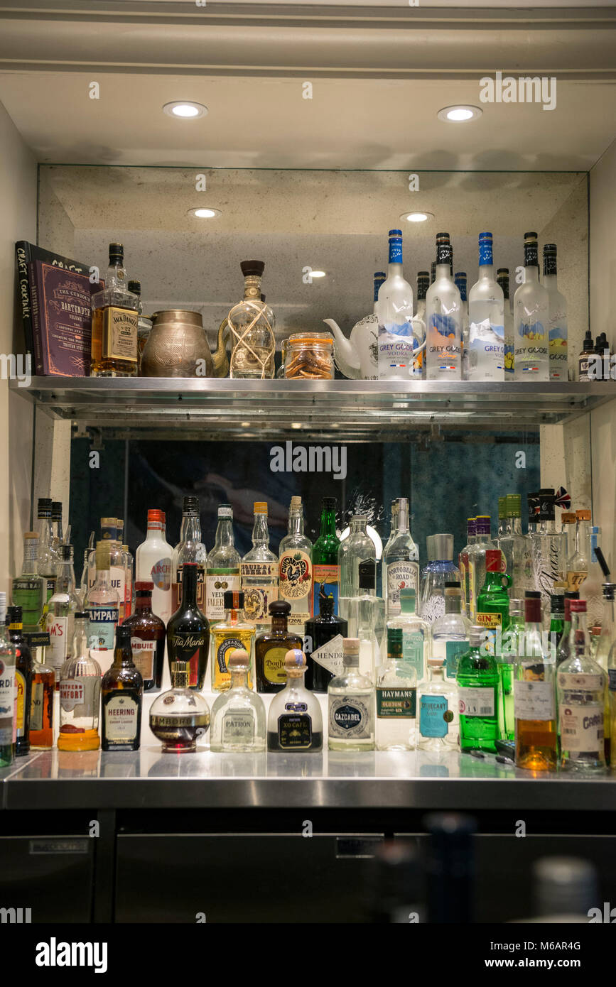 a backbar display and beer pumps with drinks on tap at a hotel bar ...