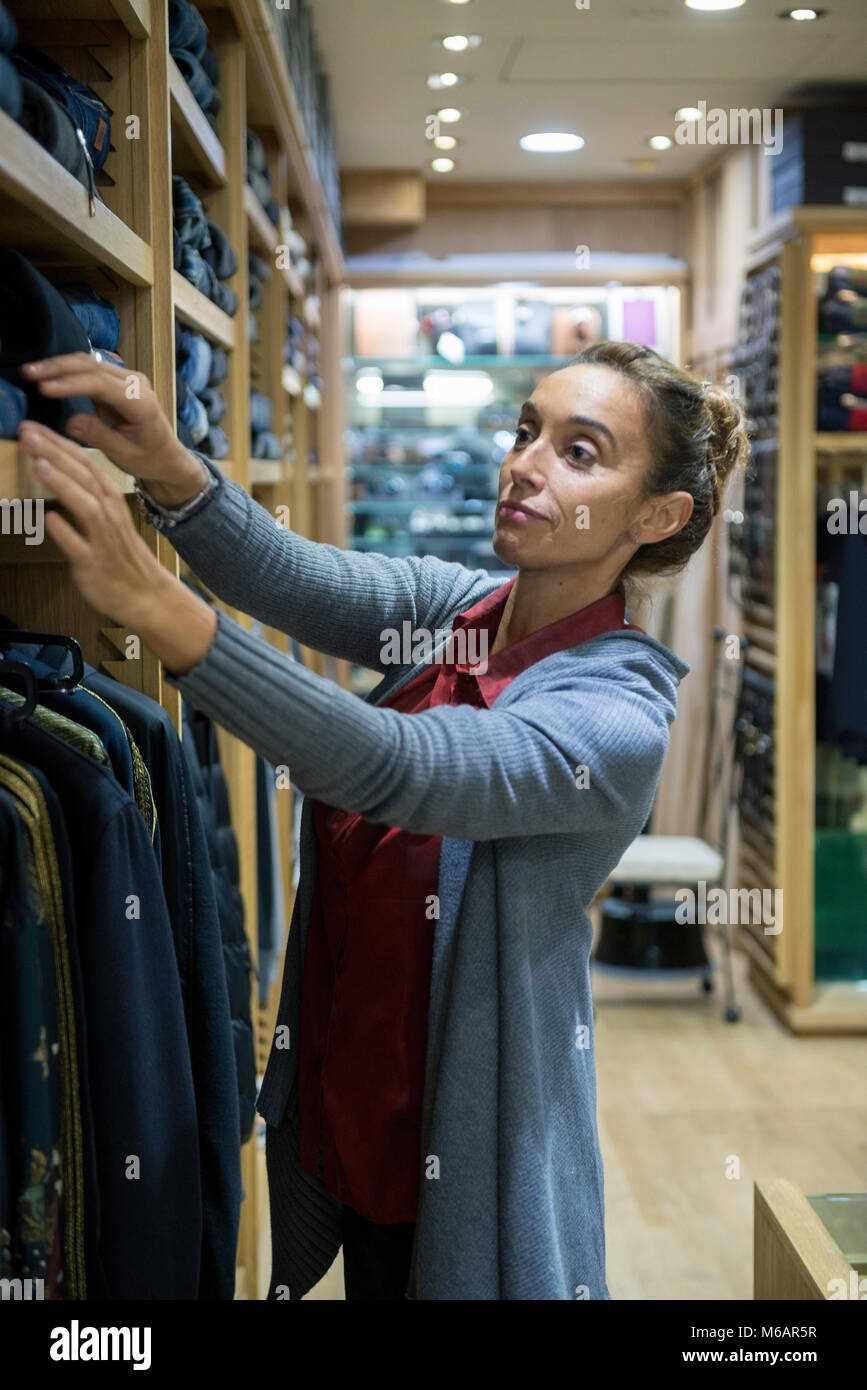 a female worker in a mens fashion retail small business shop Stock ...