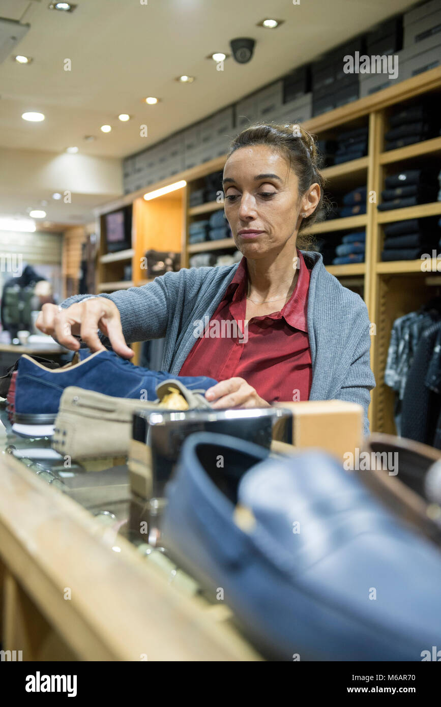 Woman working in mens clothing hi-res stock photography and images - Alamy