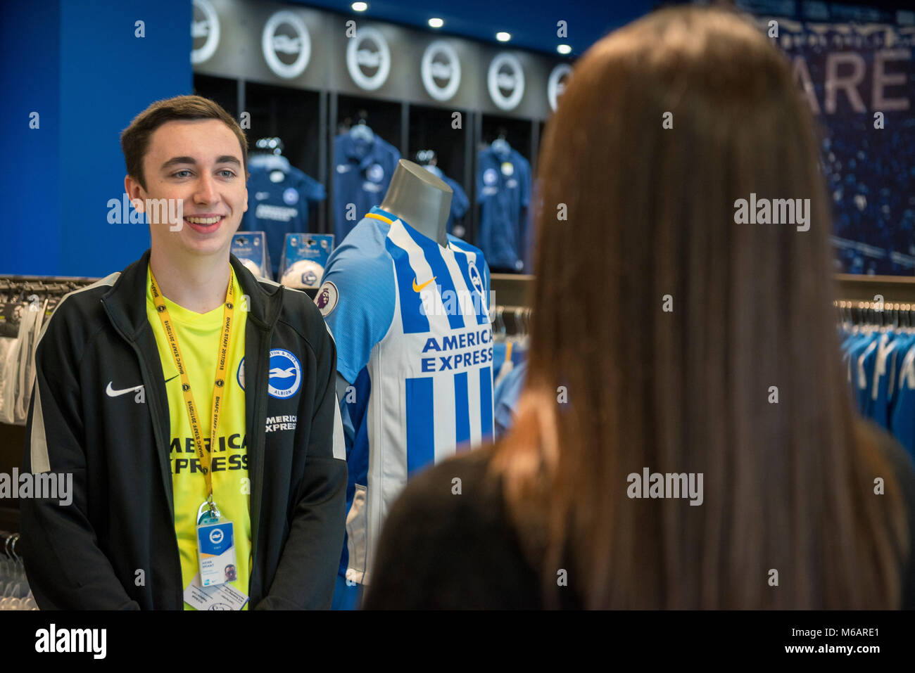 a male member of staff at the club shop at the Brighton and Hove Albion ...