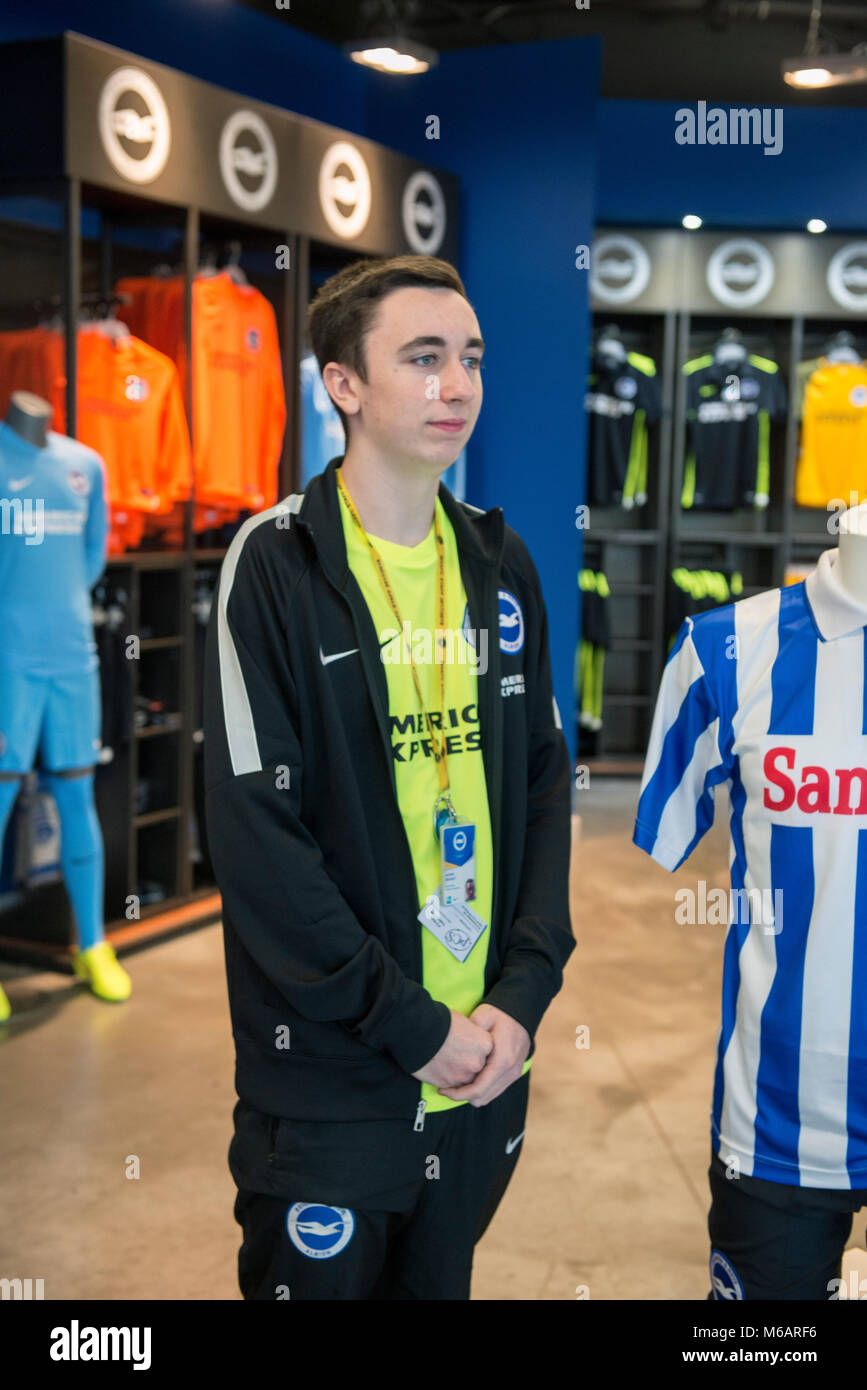 a male member of staff at the club shop at the Brighton and Hove Albion ...