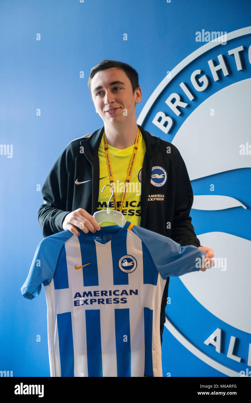 a male member of staff at the club shop at the Brighton and Hove Albion ...