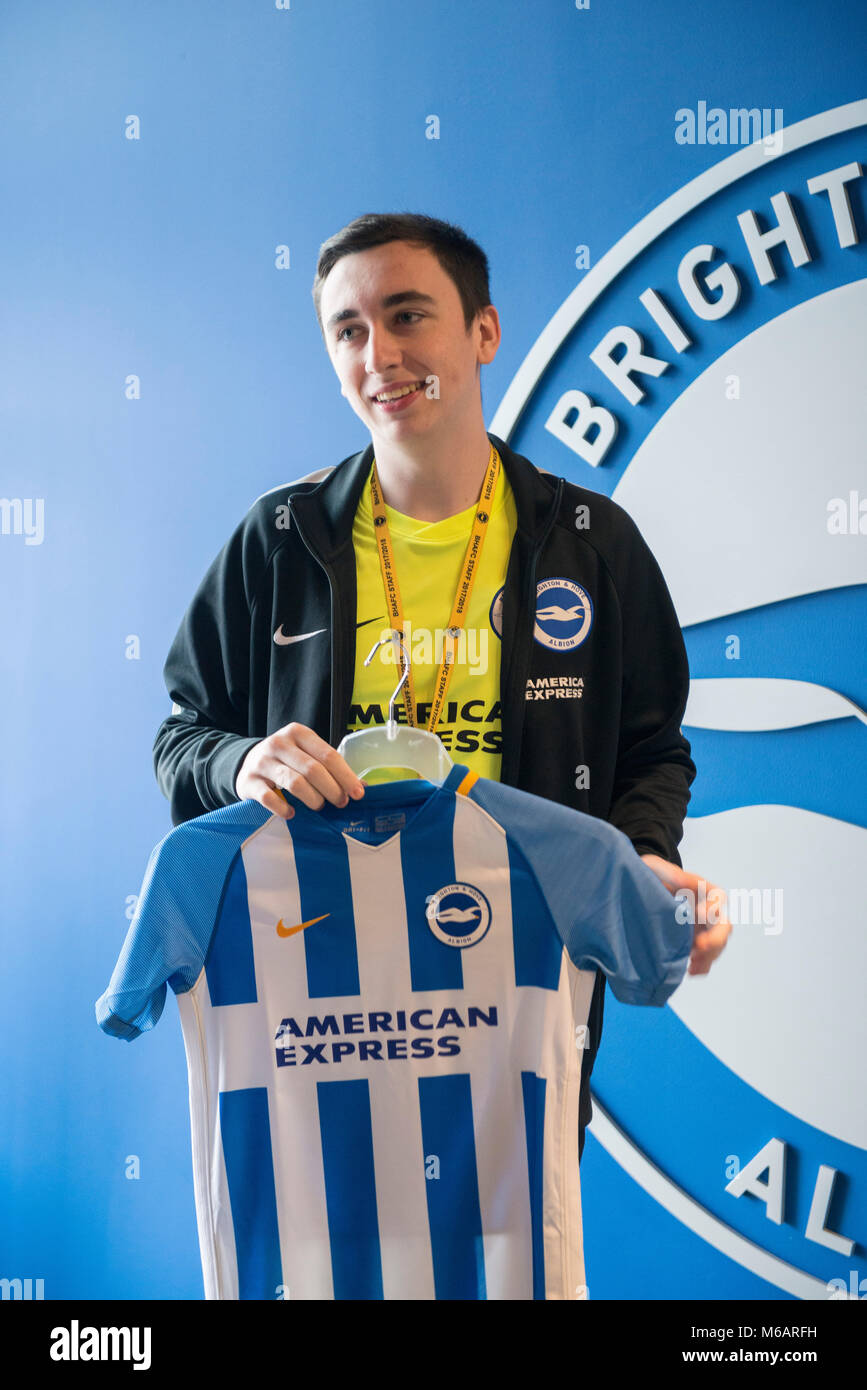 a male member of staff at the club shop at the Brighton and Hove Albion ...