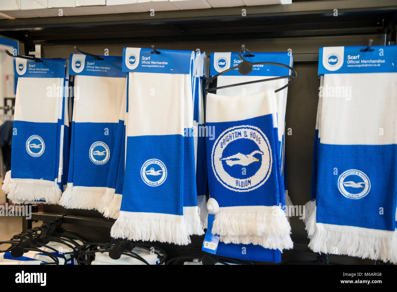 photos of the display of football kit and merchandise in the club shop ...