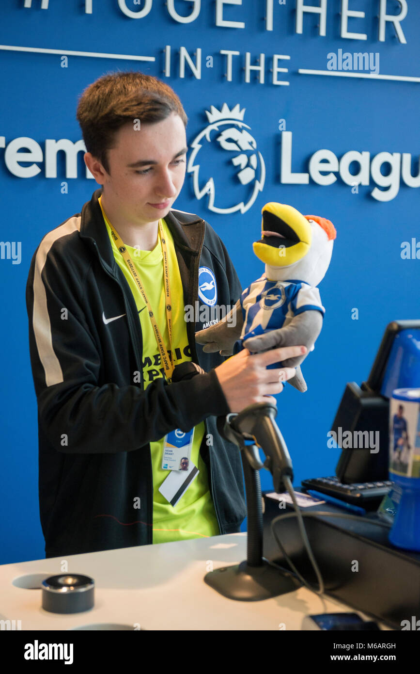 a male member of staff at the club shop at the Brighton and Hove Albion ...