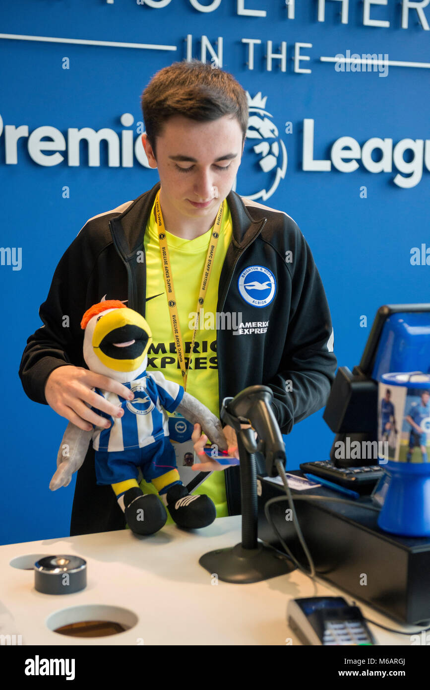 a male member of staff at the club shop at the Brighton and Hove Albion ...