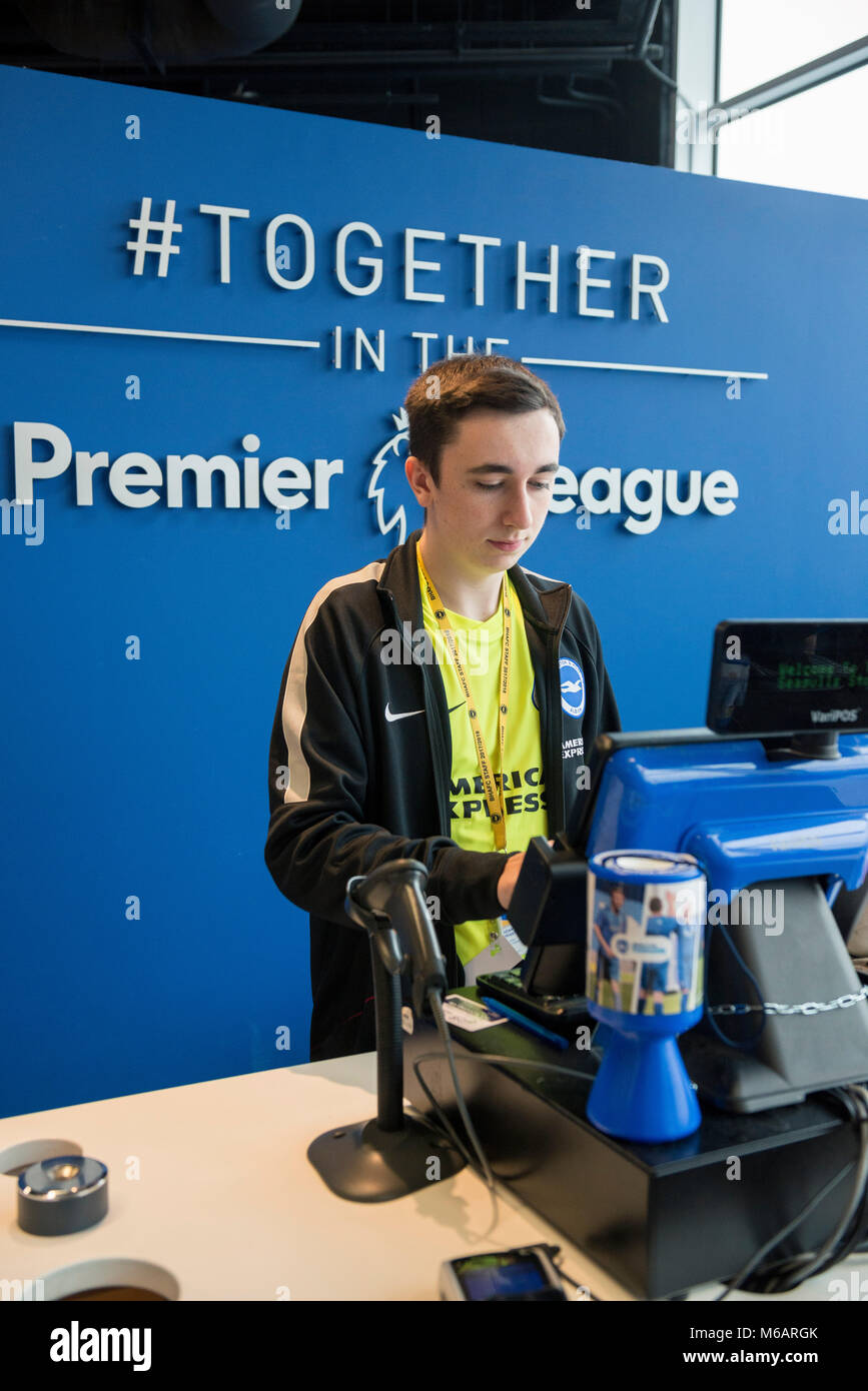 a male member of staff at the club shop at the Brighton and Hove Albion ...