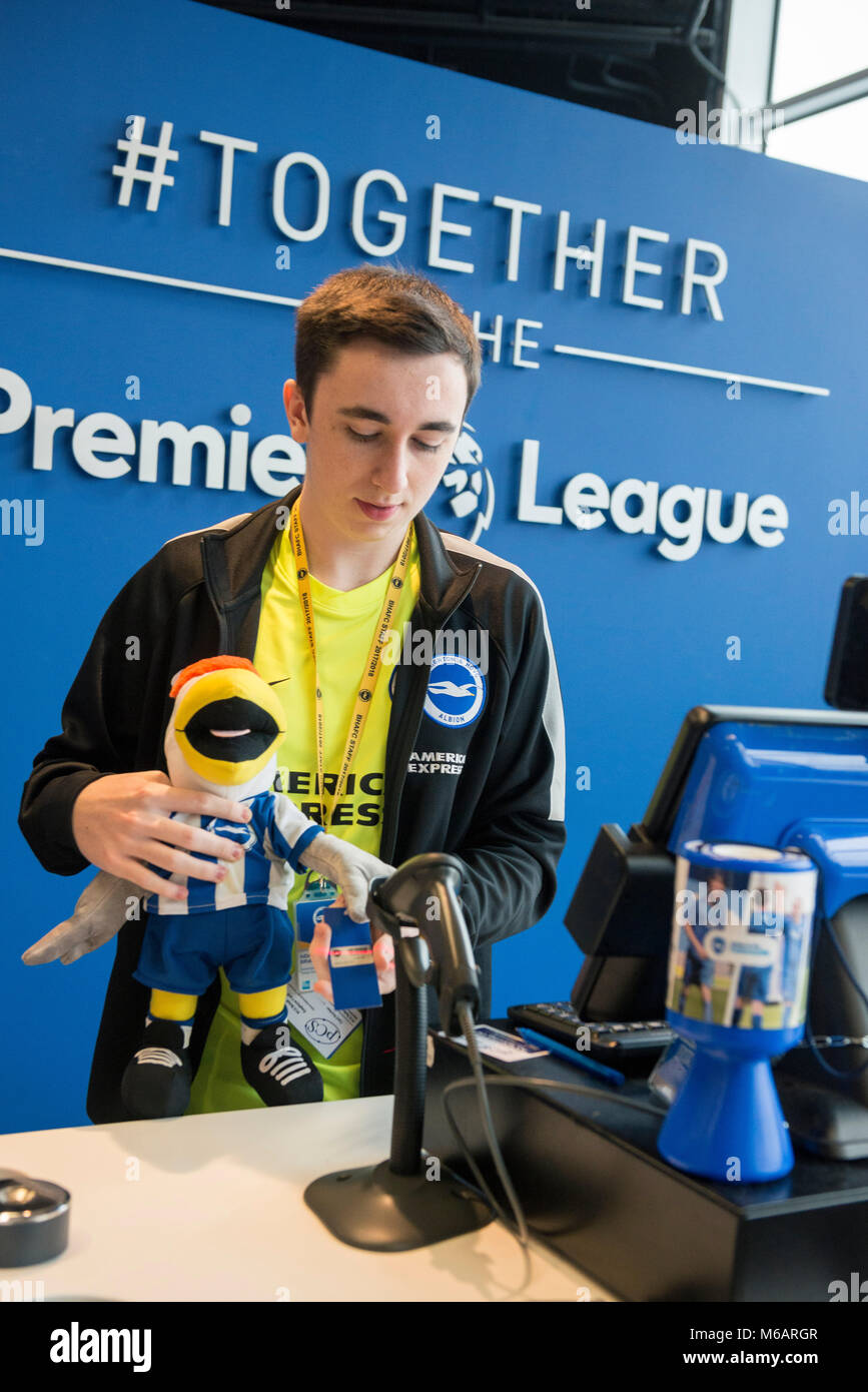 a male member of staff at the club shop at the Brighton and Hove Albion ...