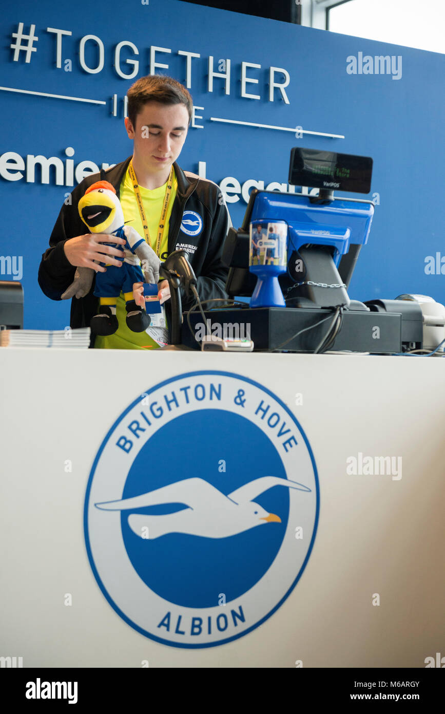 a male member of staff at the club shop at the Brighton and Hove Albion ...