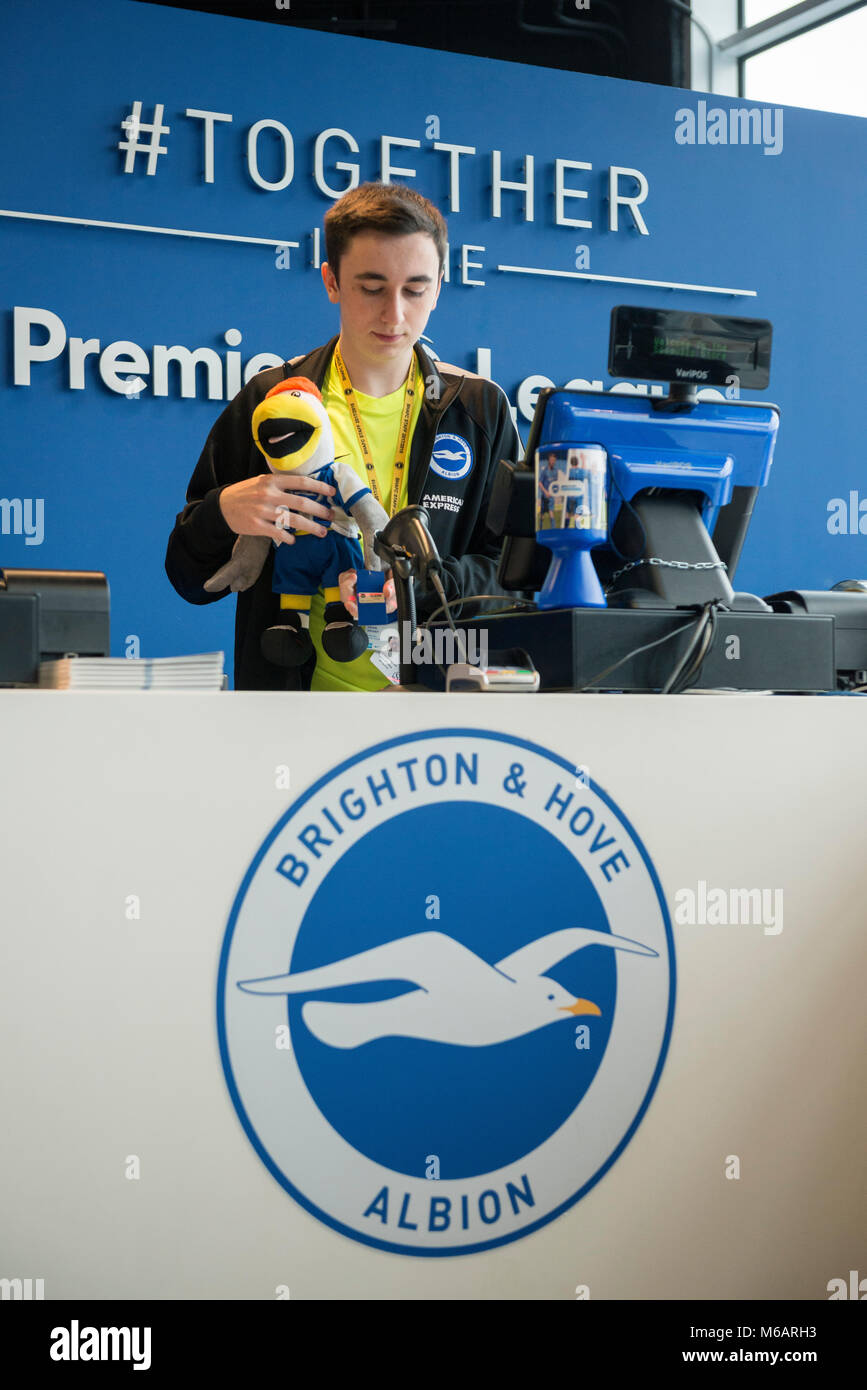 a male member of staff at the club shop at the Brighton and Hove Albion ...