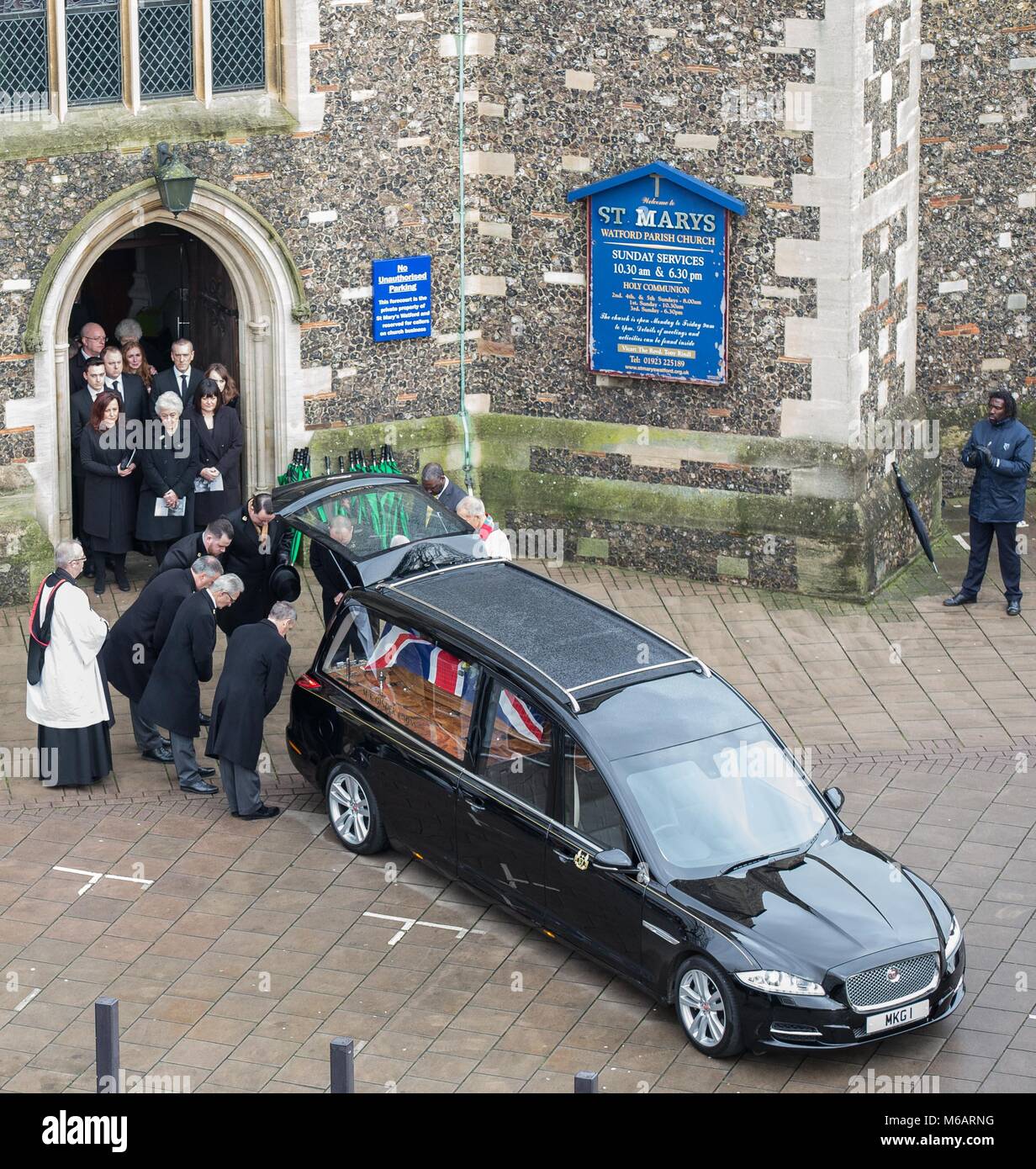 Rita Taylor (Graham's wife) and family watch as the coffin is placed ...