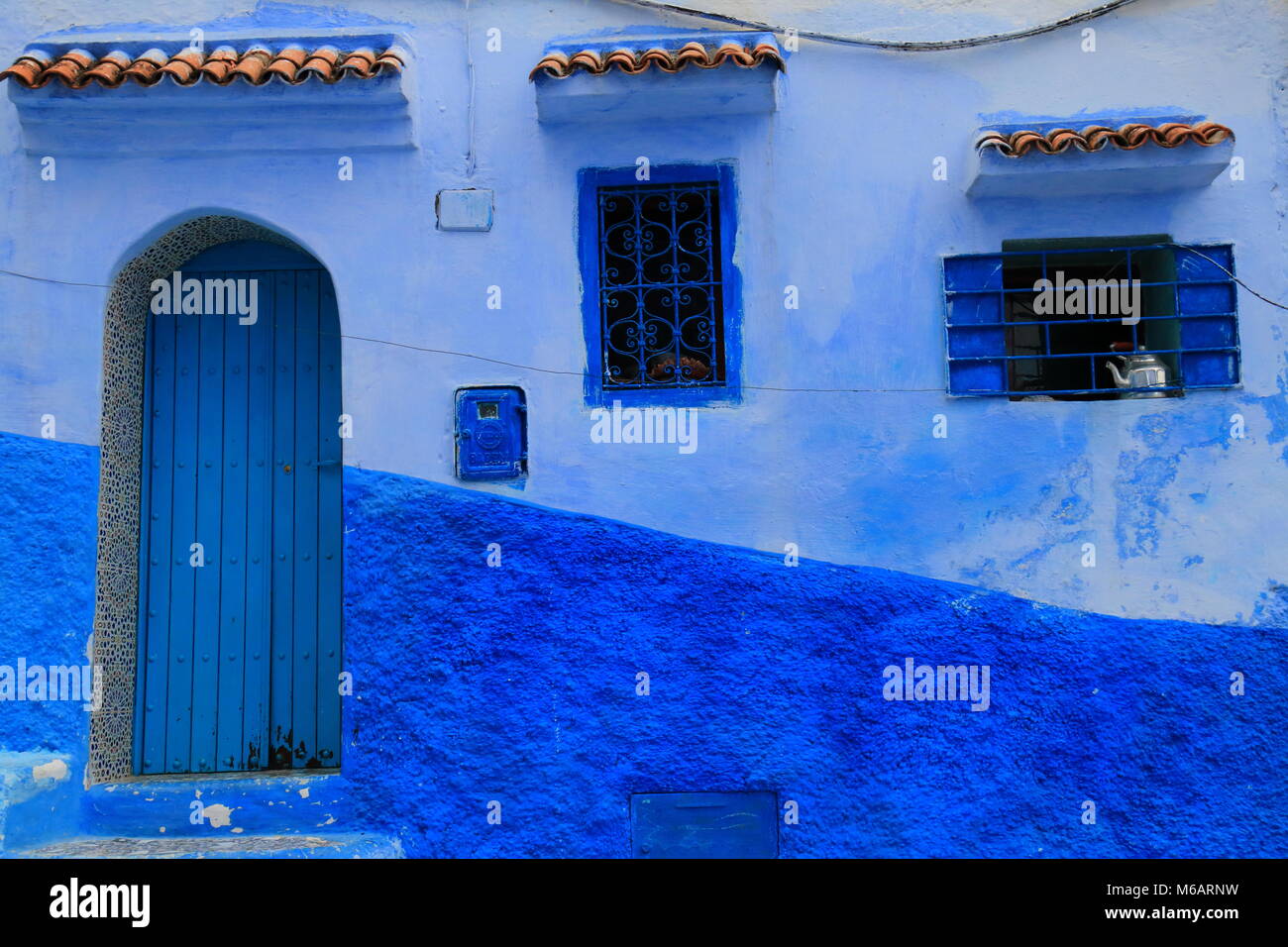 Traditional wooden door of house in the village of Chefchaouen Stock ...
