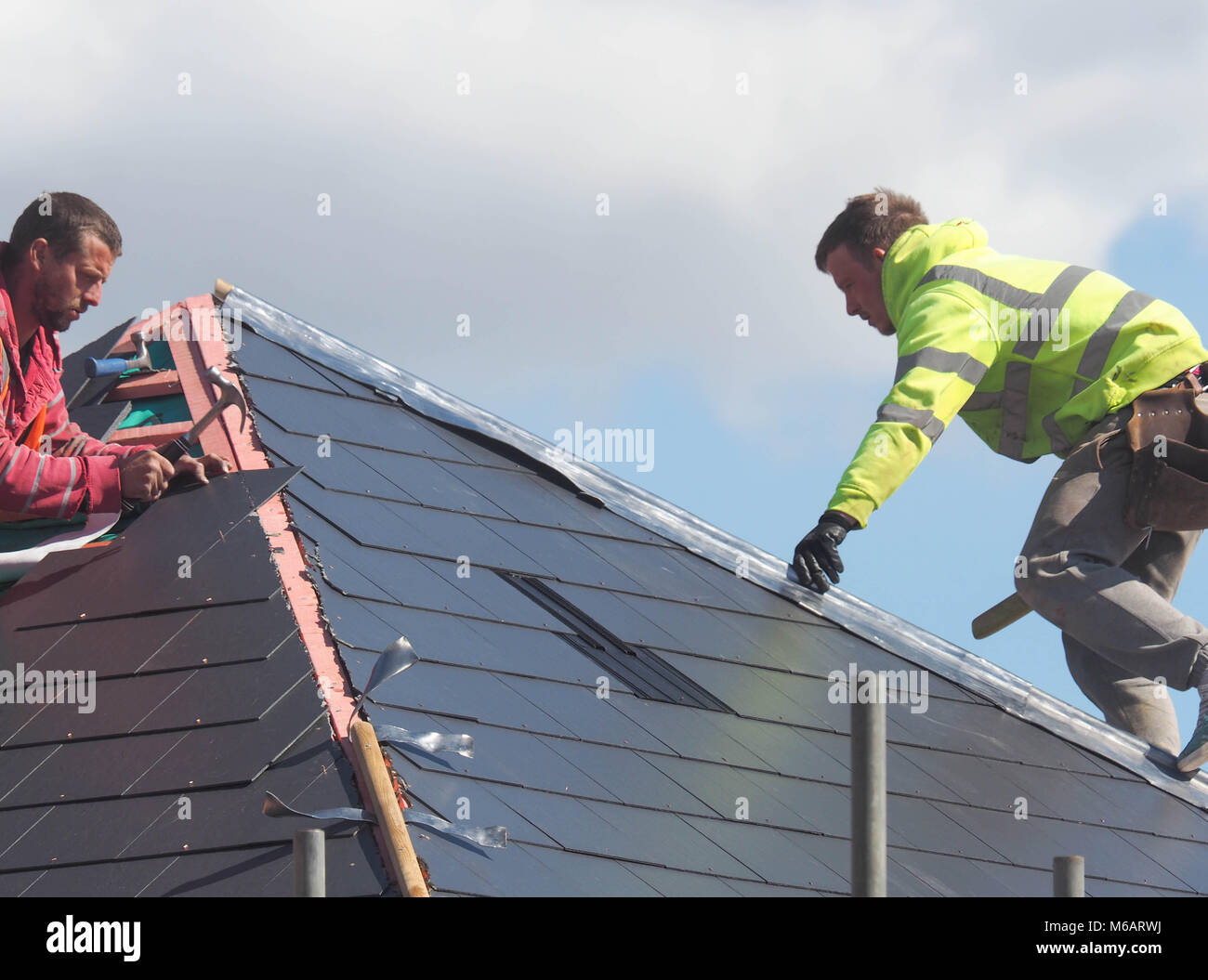 ROOFING CONTRACTORS WORKING ON ROOF OF NEW BUILD HOPKINS HOMES ...