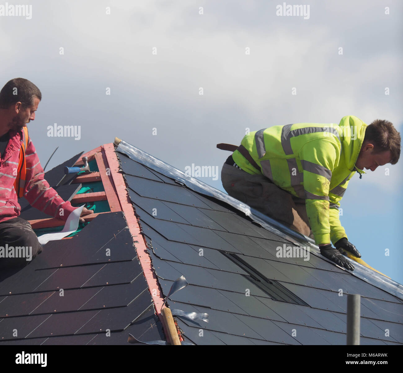 ROOFING CONTRACTORS WORKING ON ROOF OF NEW BUILD HOPKINS HOMES ...