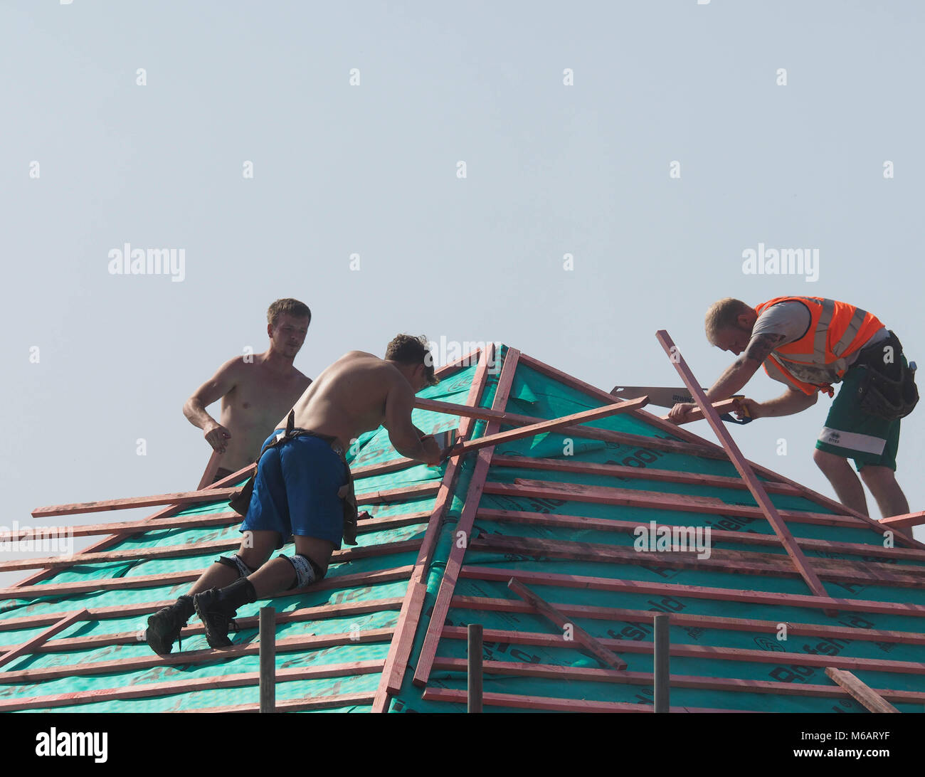 ROOFING CONTRACTORS WORKING ON ROOF OF NEW BUILD HOPKINS HOMES ...