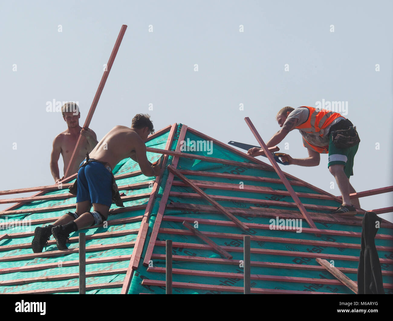 ROOFING CONTRACTORS WORKING ON ROOF OF NEW BUILD HOPKINS HOMES ...