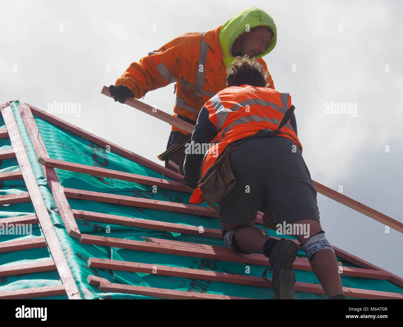 ROOFING CONTRACTORS WORKING ON ROOF OF NEW BUILD HOPKINS HOMES ...