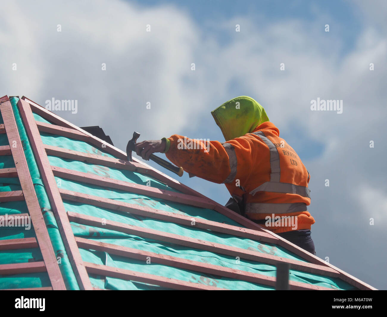 ROOFING CONTRACTORS WORKING ON ROOF OF NEW BUILD HOPKINS HOMES ...