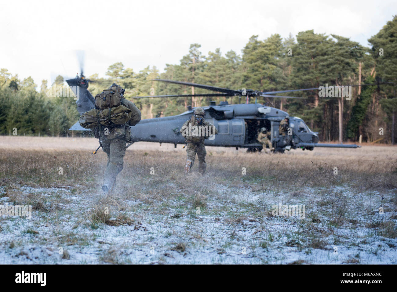 Pararescuemen assigned to 57th Rescue Squadron dash toward a 56th RQS ...