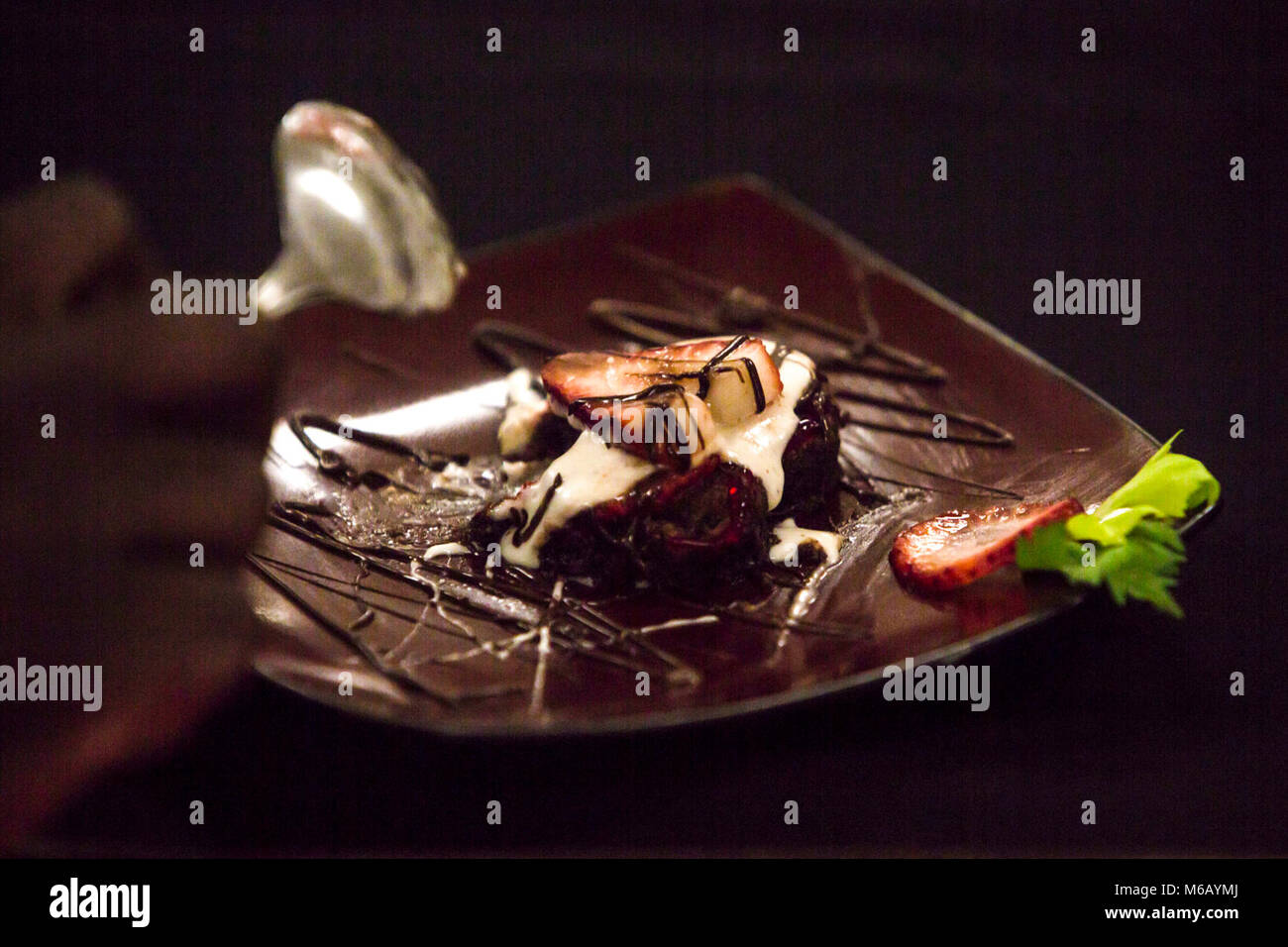 A judge samples a dessert prepared by Lance Cpl. Meliza MolinaCrespo, a ...