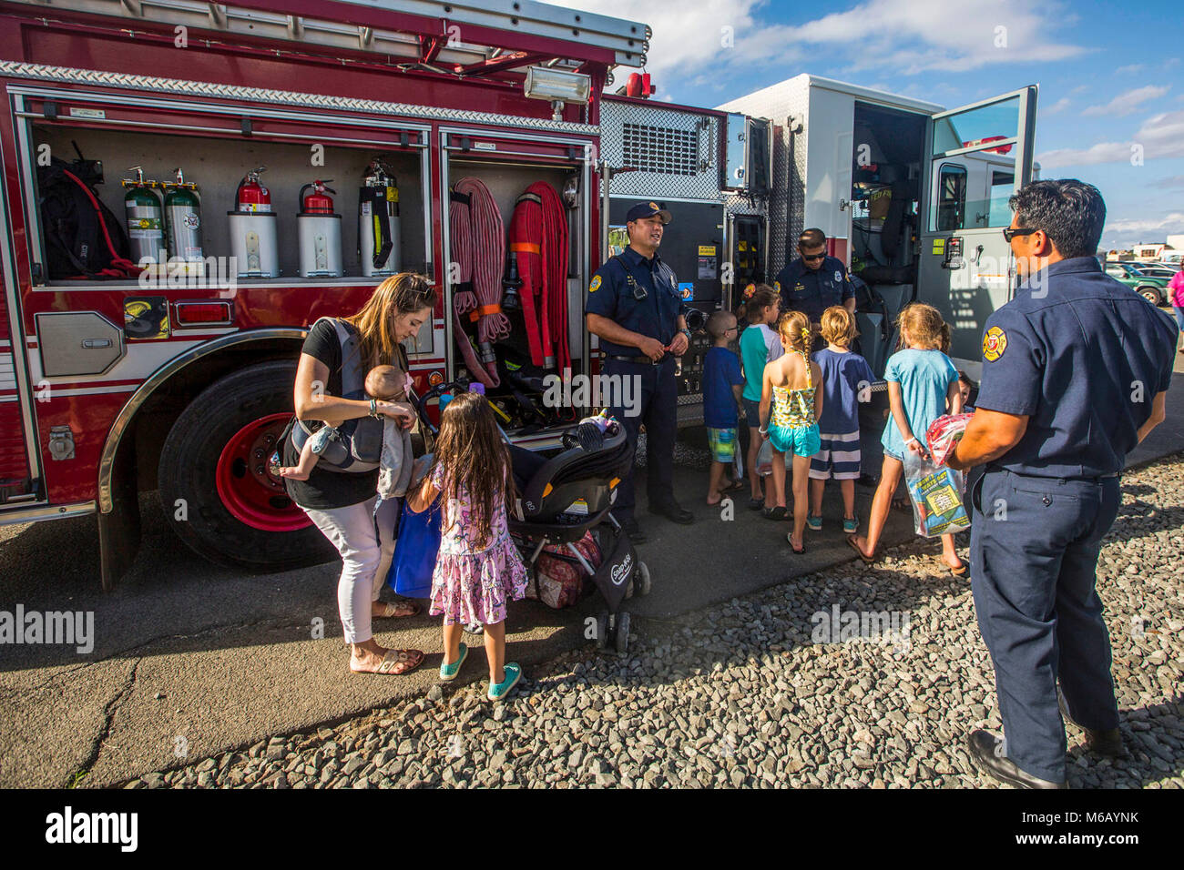 Firefighters with the Marine Corps Base Hawaii Fire Department give a ...