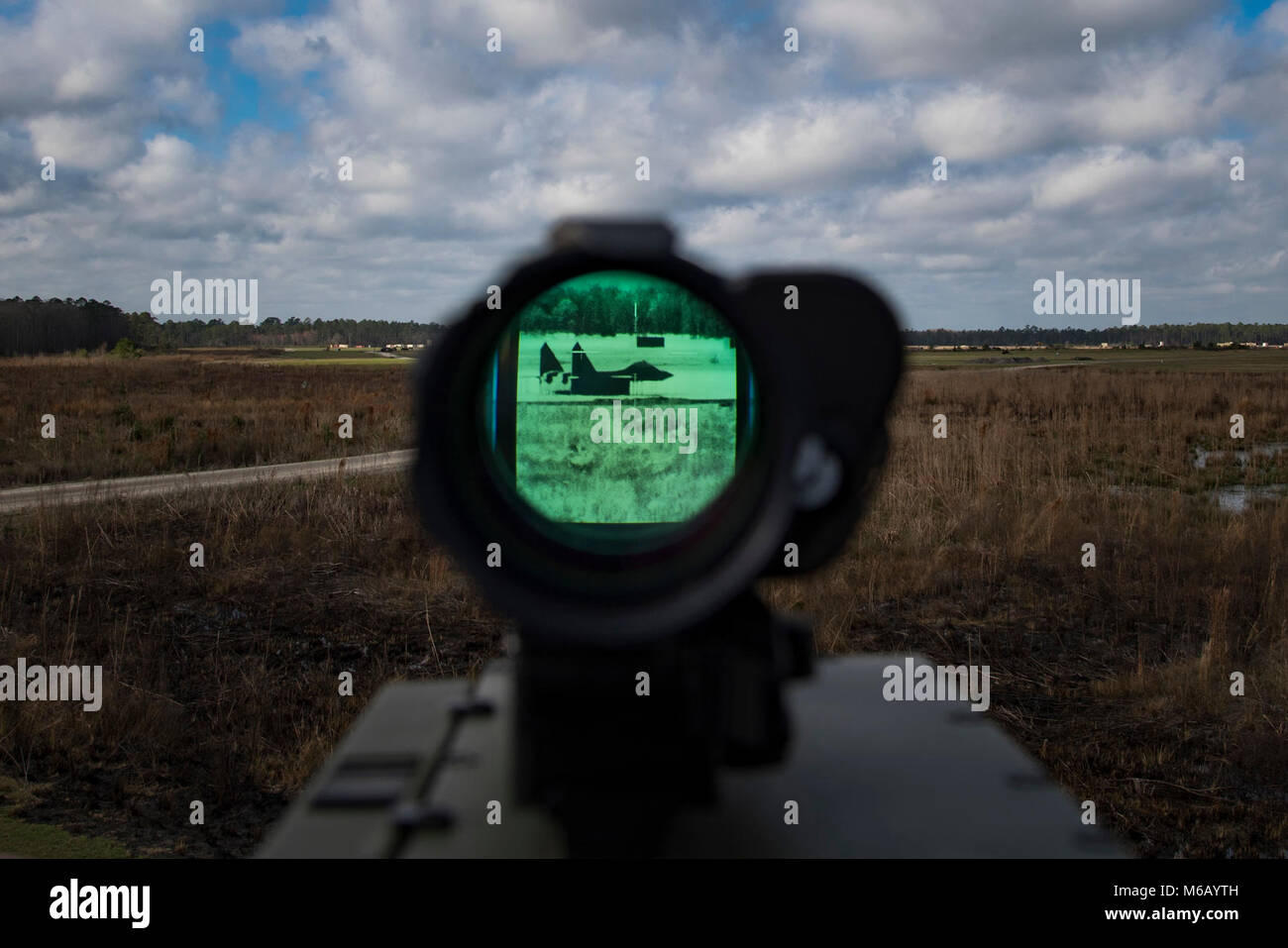 A laser target designator is calibrated to a simulated enemy target ...