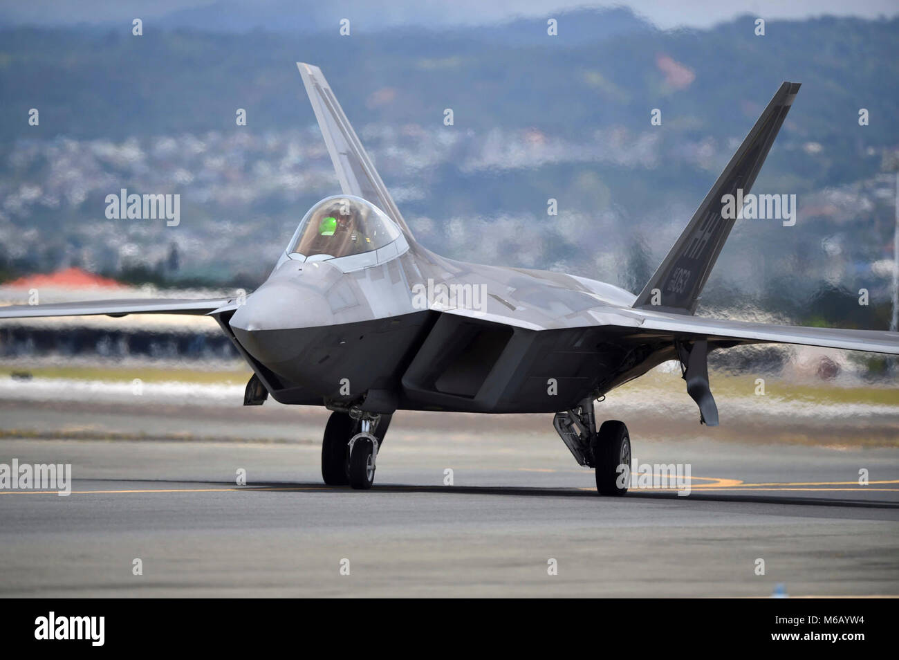An F-22 Raptor taxis down the runway after landing at Joint Base Pearl ...