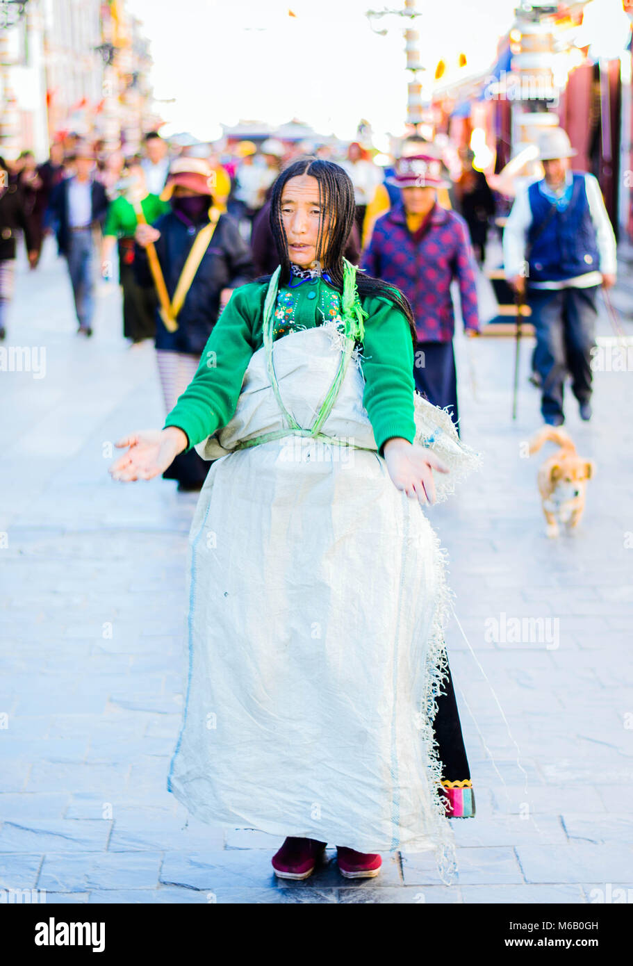 Tibetan Woman in Traditional clothes at Potala Palace in Lhasa Tibet ...
