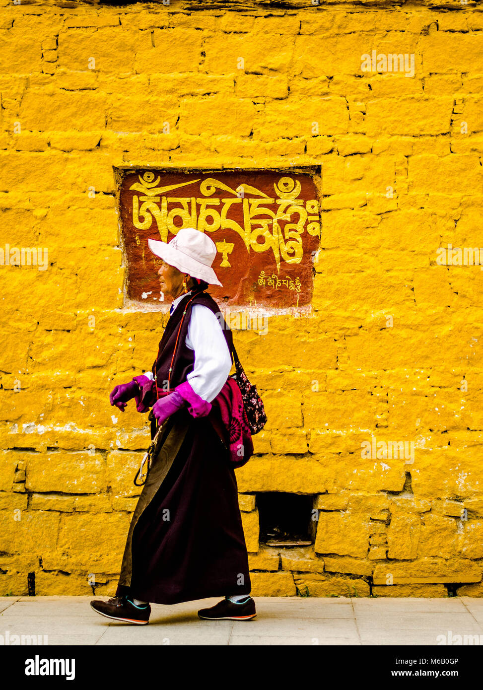 A Tibetan Monk in red robe Stock Photo - Alamy