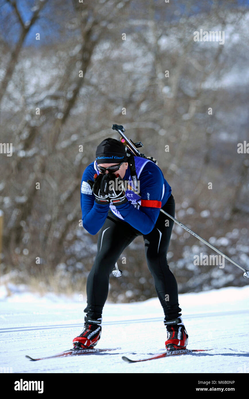 A biathlete competes in the opening sprint event at the Chief National ...