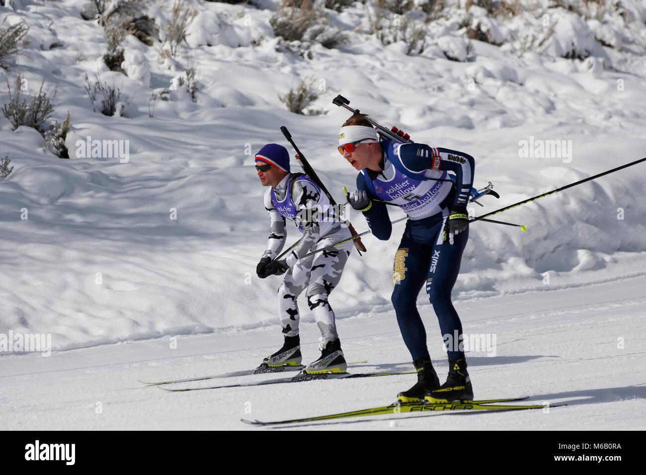 Spc. Travis Cooper of the Alaska National Guard begins to pass Staff ...