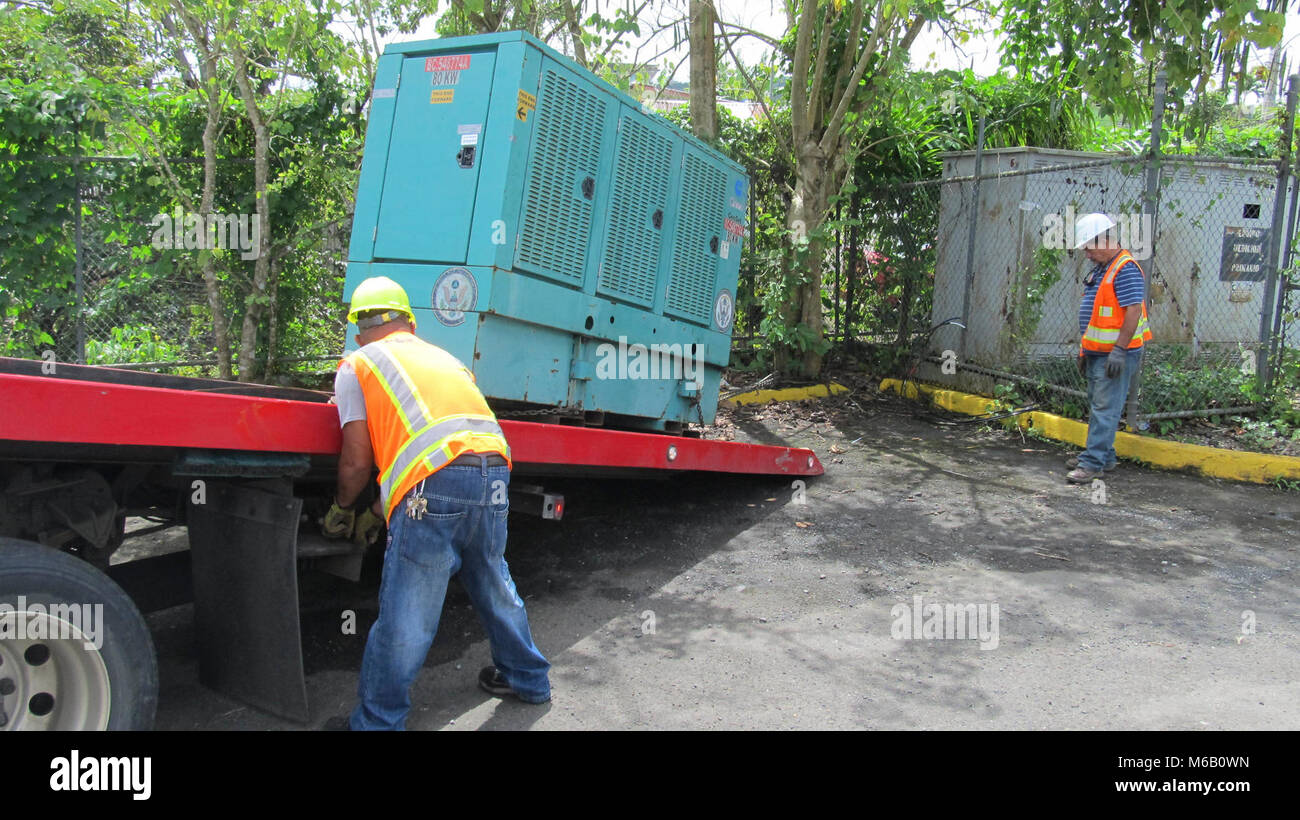 U.S. Army Corps of Engineers contractors work offload the temporary ...