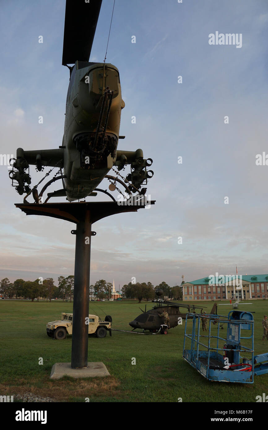 The Fort Stewart main gate static display AH-1 Cobra is bathed in ...