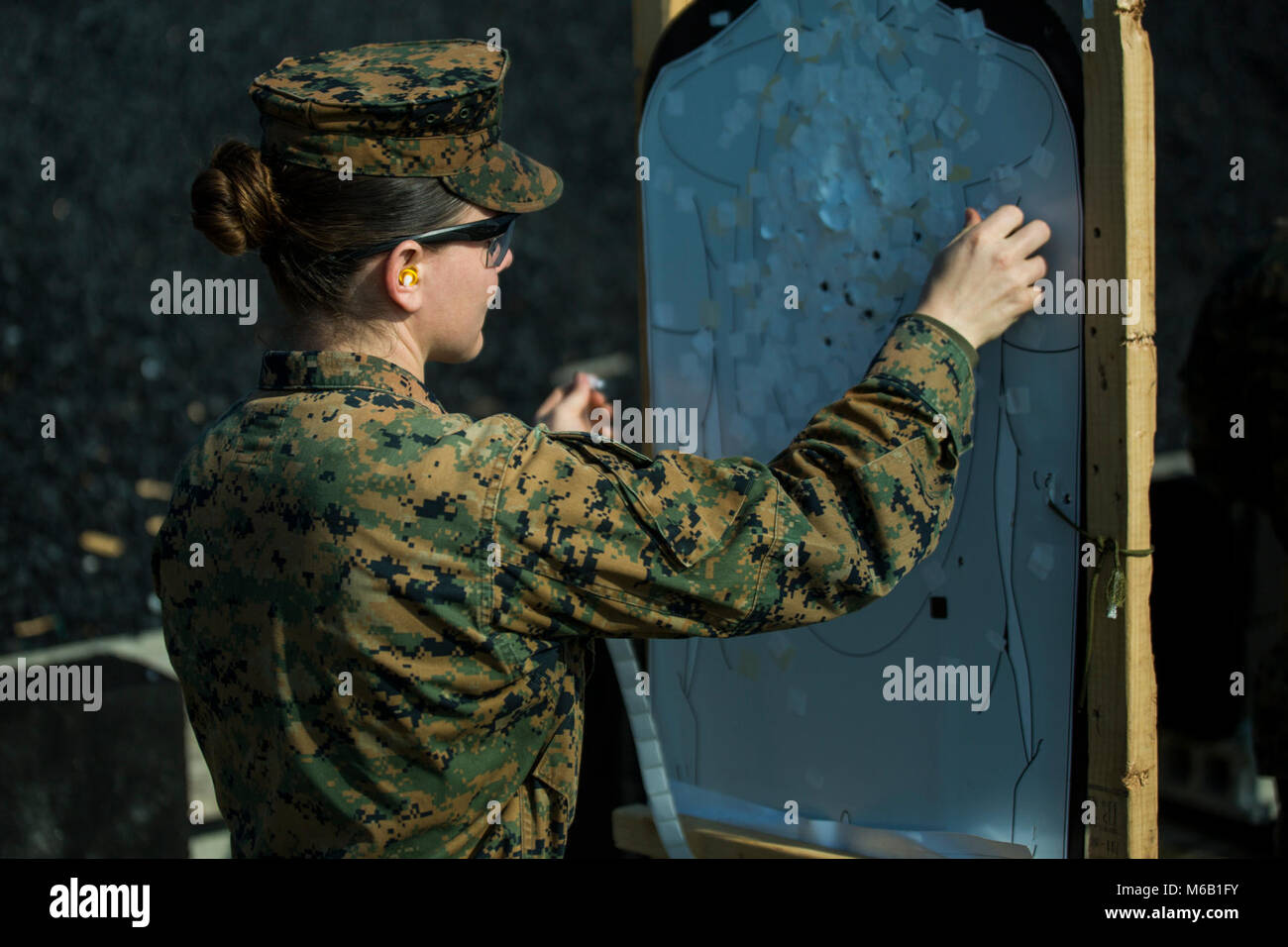 2nd Lt. Heidi Swisher fixes her target during an annual pistol ...