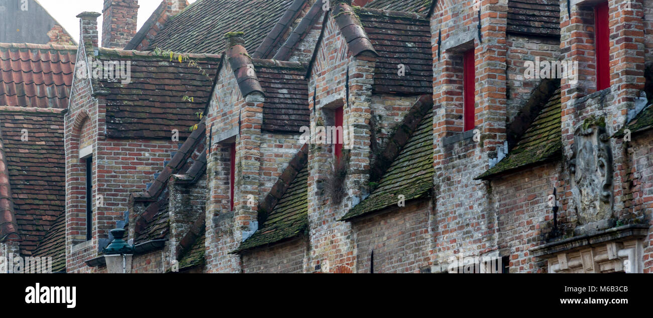 Ancient brick Bruges roofline with five Gothic walled dormer windows ...