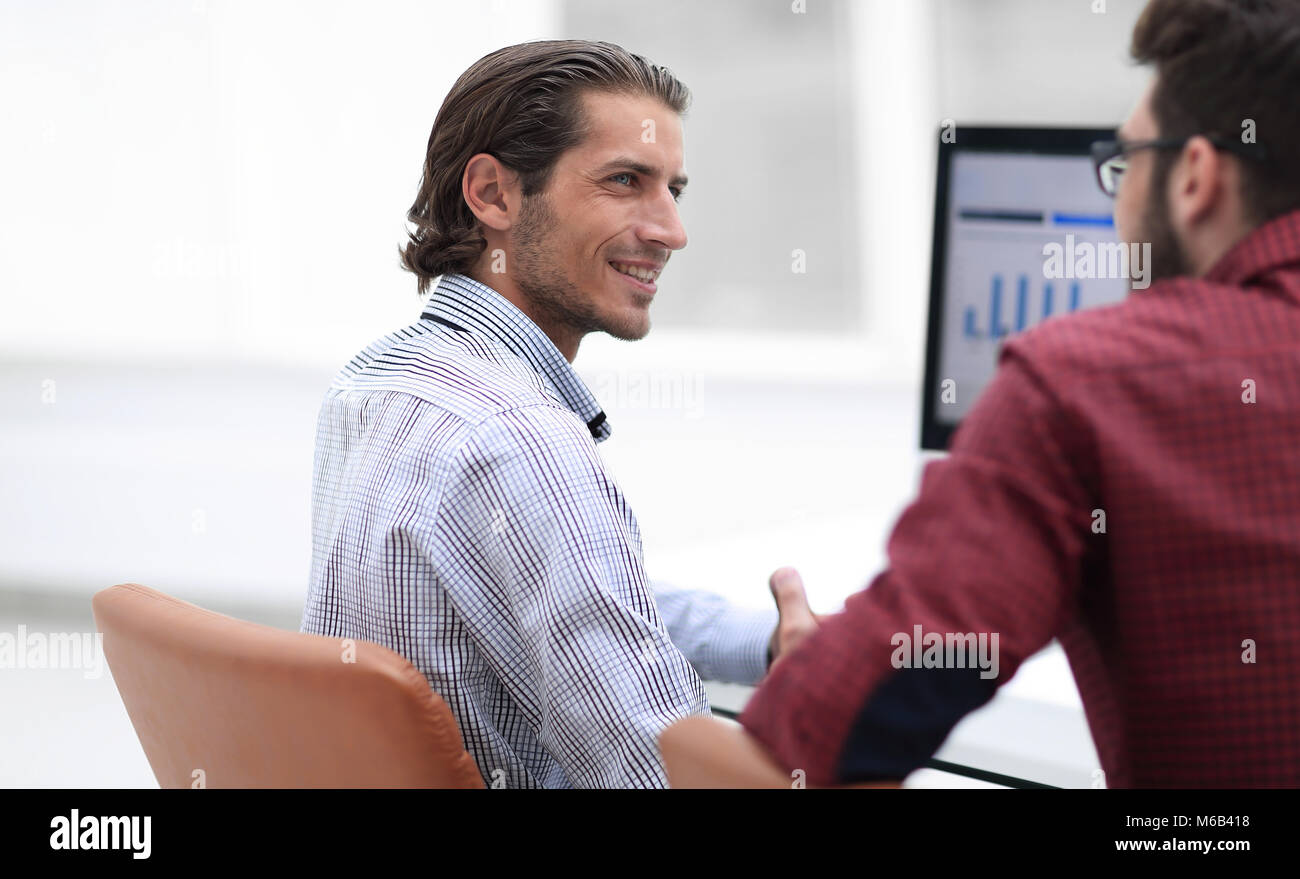 smiling employee talking with a colleague Stock Photo - Alamy