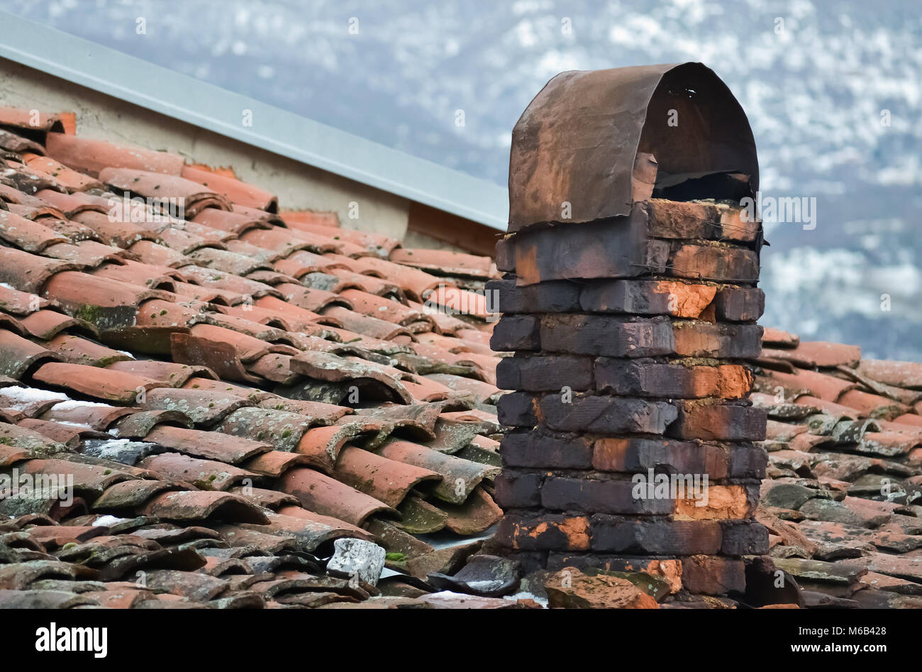 Closeup of an old rotting chimney of a small house in a village Stock ...