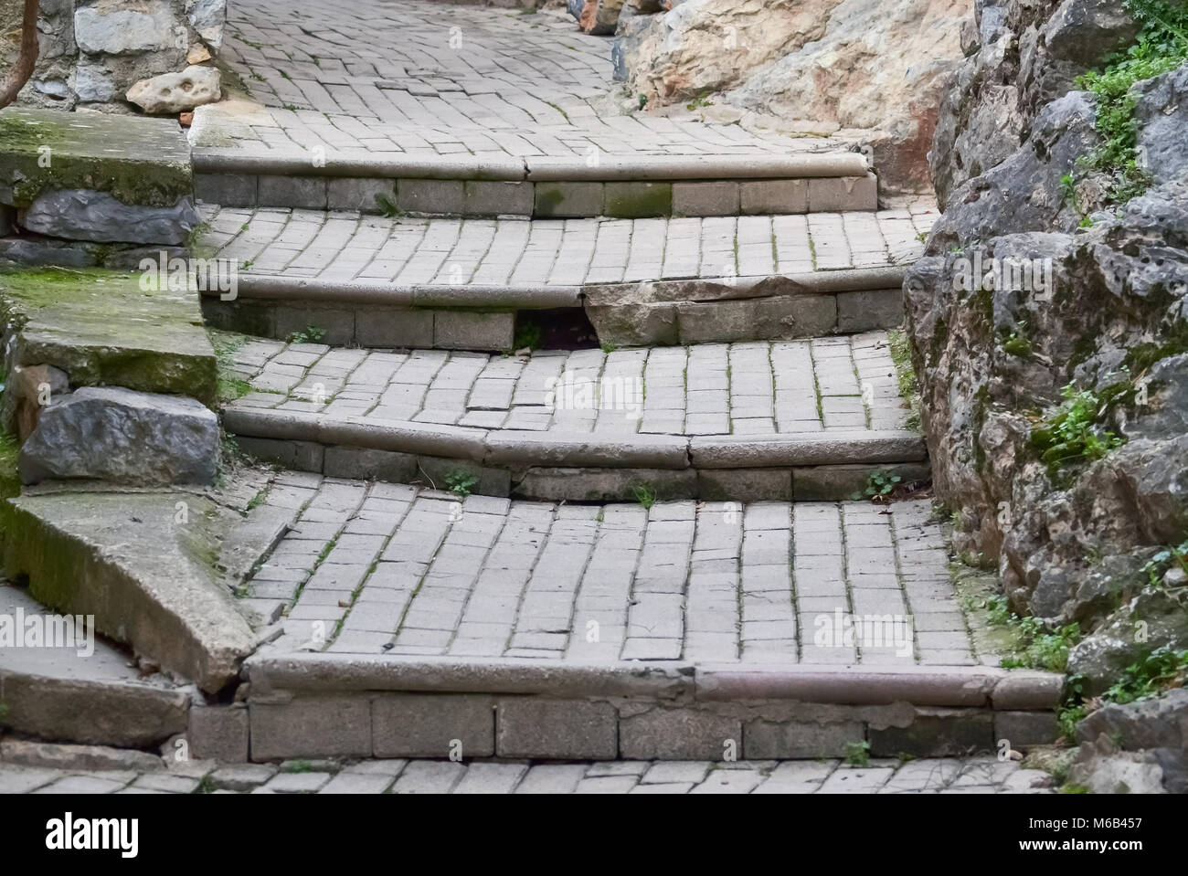 Detail of a small pedestrian street in Ohrid city made of cobblestone ...