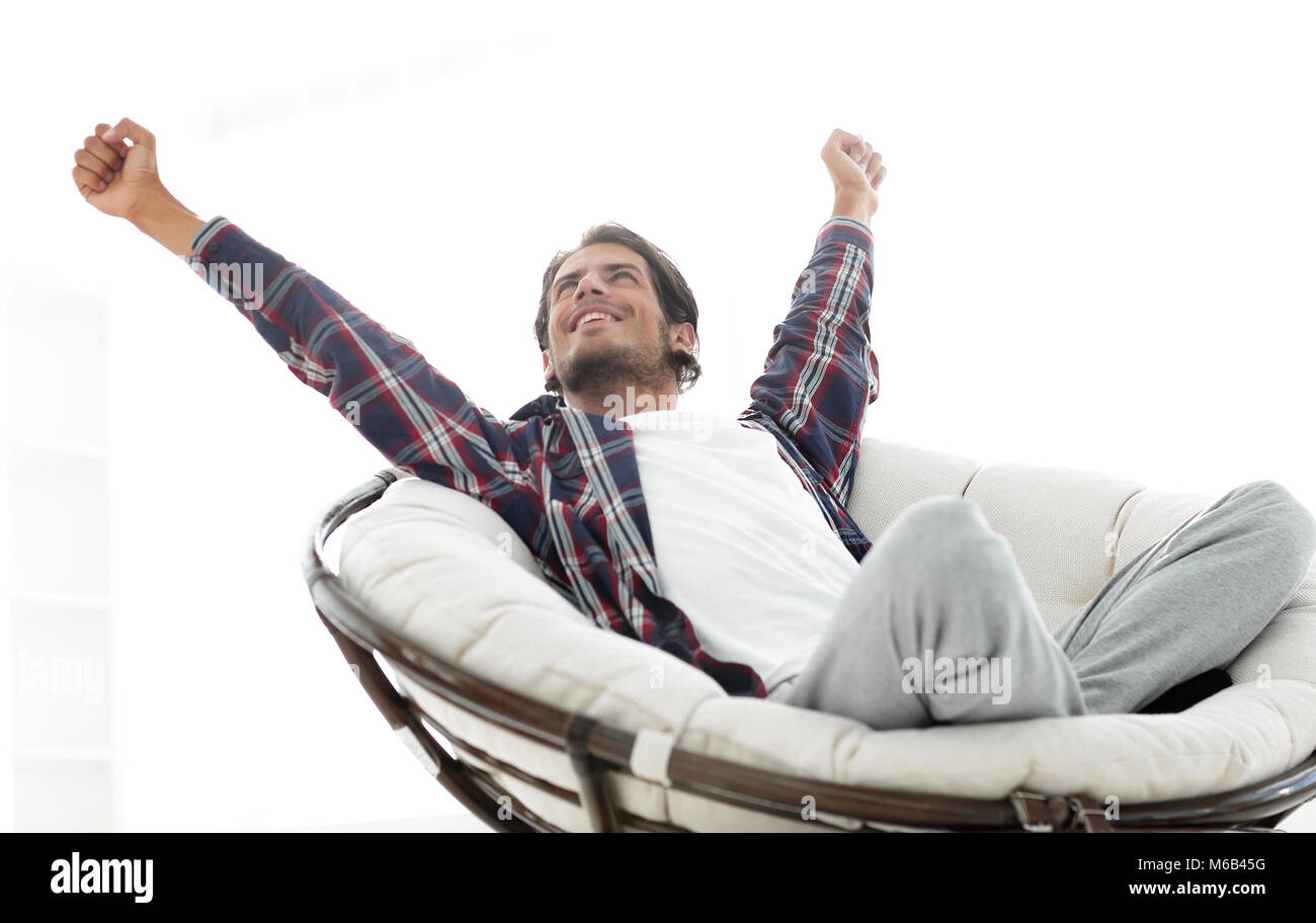 stylish guy stretching in a comfortable chair Stock Photo - Alamy