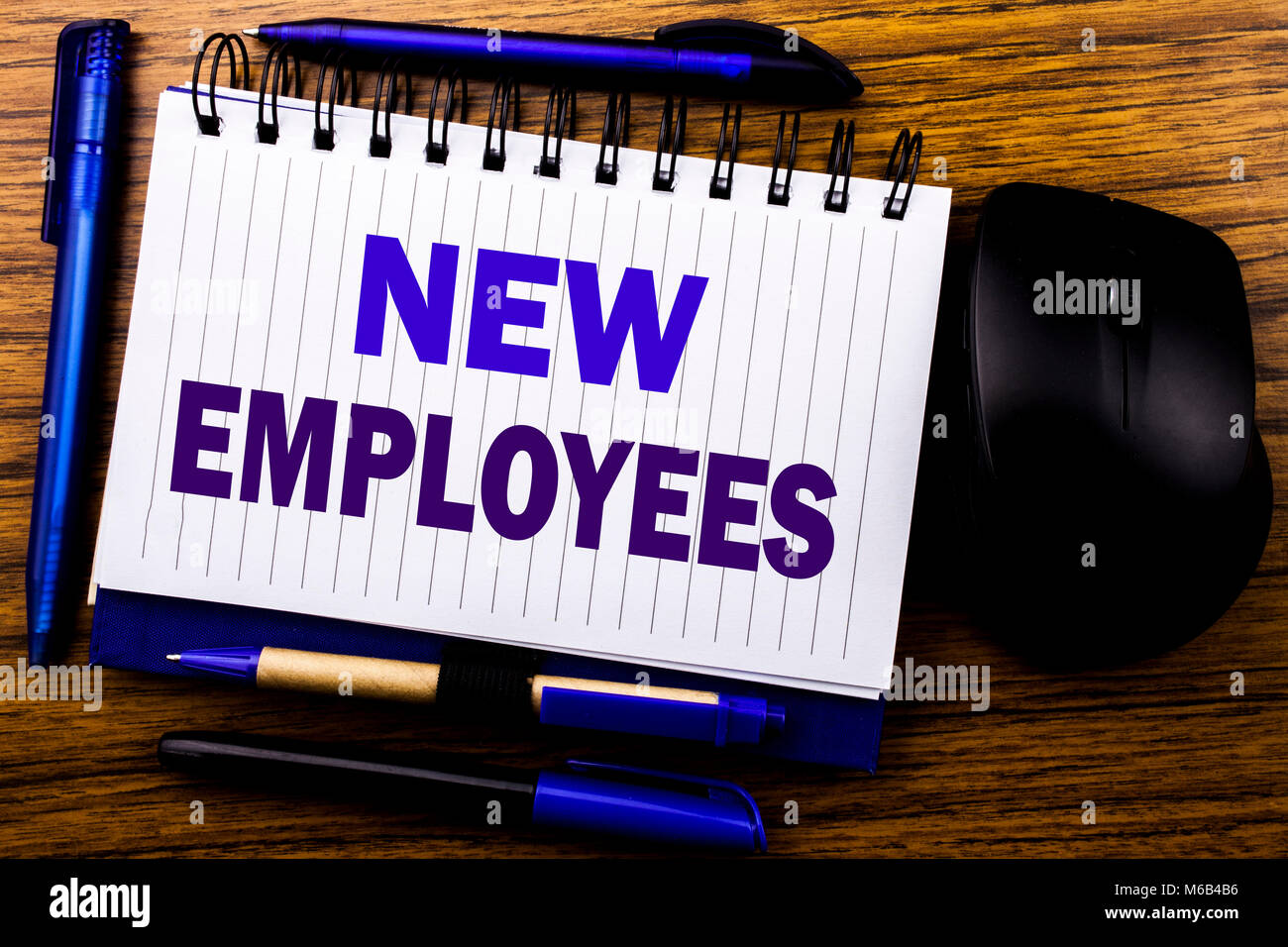 Handwritten text showing New Employees. Business concept for Welcome ...
