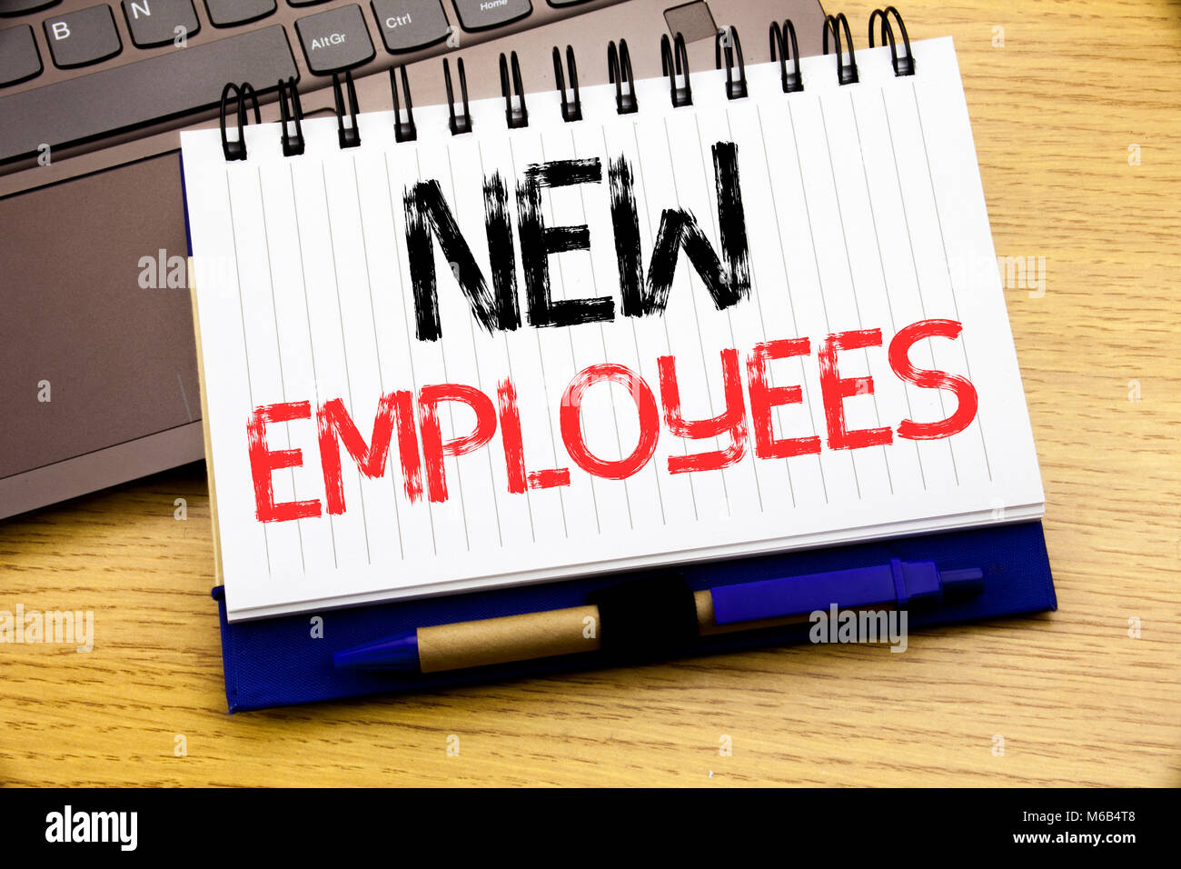 Word, writing New Employees. Business concept for Welcome Staf ...