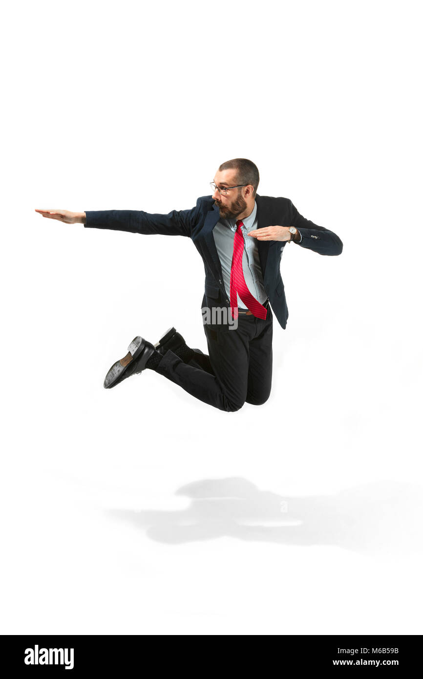 Funny cheerful businessman jumping in air over white background Stock ...